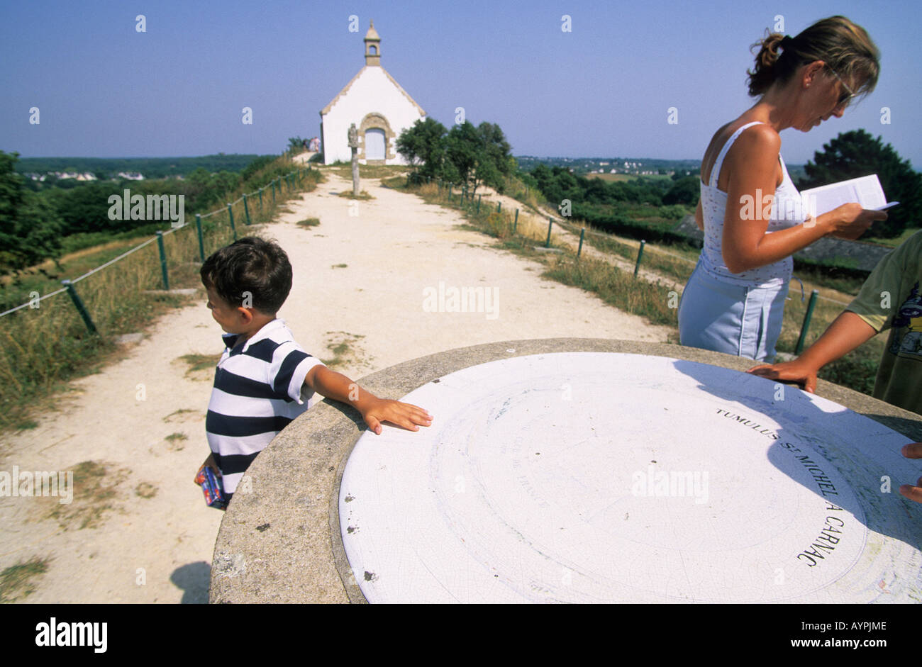 Tourist at a huge circular map marking the burial mound at Tumulus St ...