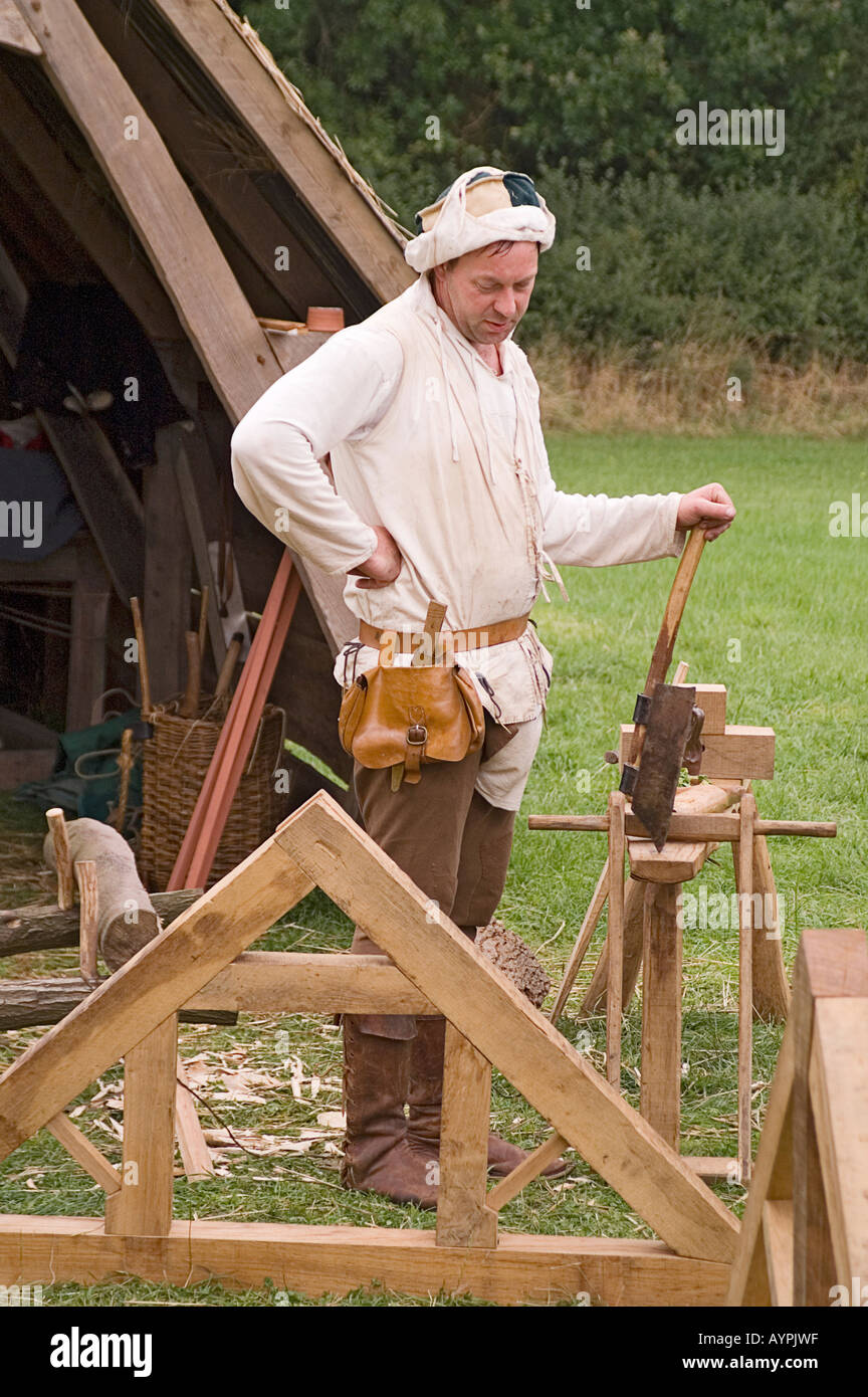 Medieval woodworker constructing a timber roof truss - this is a ...
