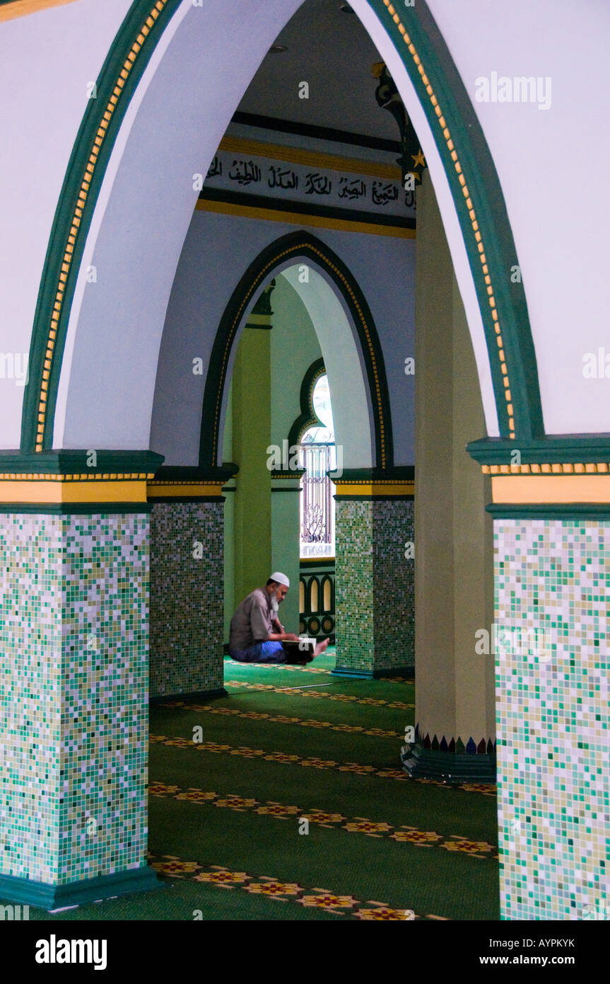 Muslim man sitting in prayer hall at Masjid Abdul Gafoor Mosque in ...
