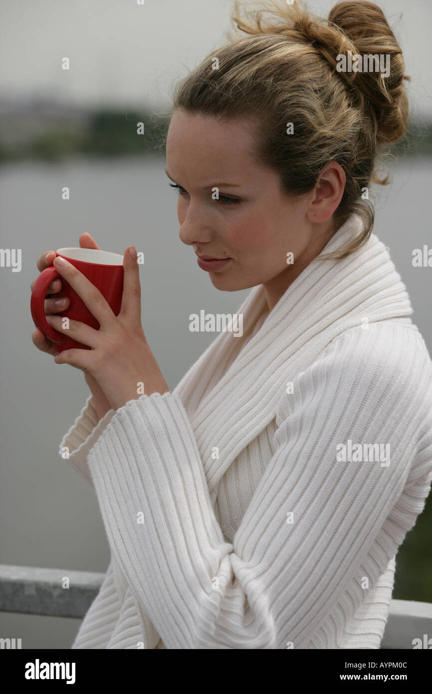 Woman taking sip from cup hi-res stock photography and images - Alamy