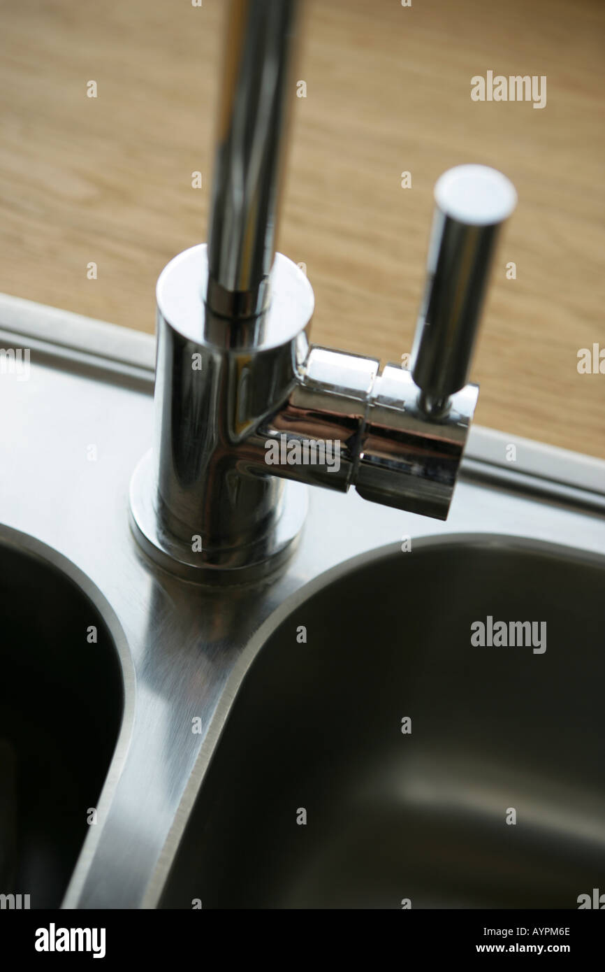 A high angle view of the base of a faucet Stock Photo - Alamy