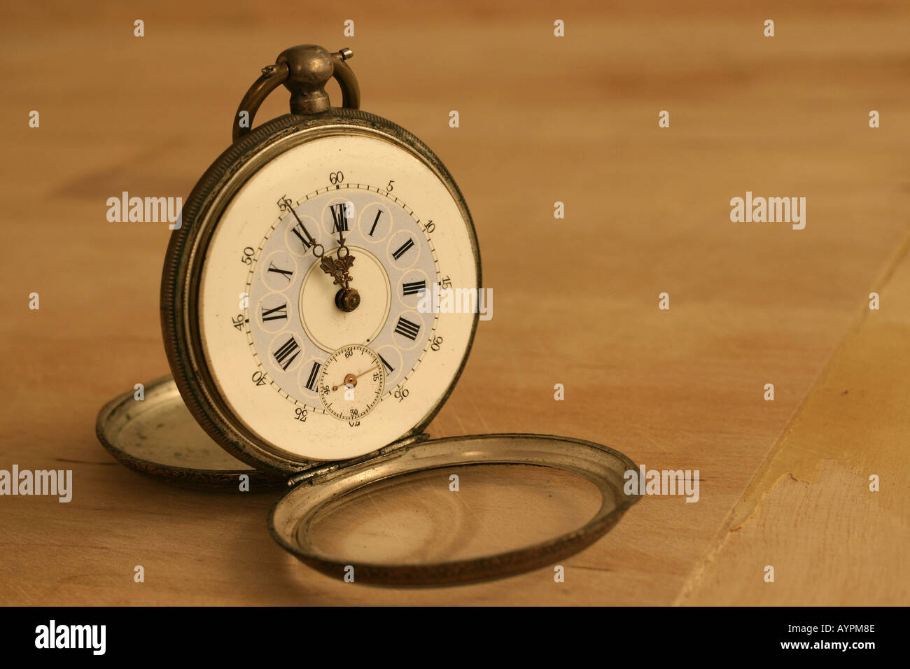 Circular glass cover of an pocket watch is opened as it is kept on the ...