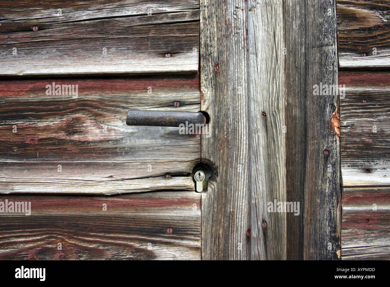 Front view of a wooden door with a handle and a keyhole Stock Photo - Alamy