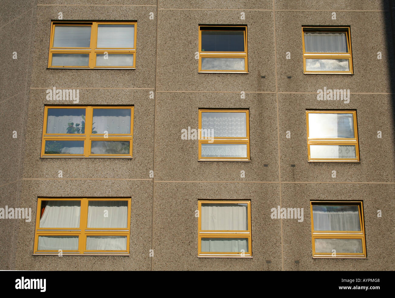 yellow framed windows on stone facade Stock Photo - Alamy