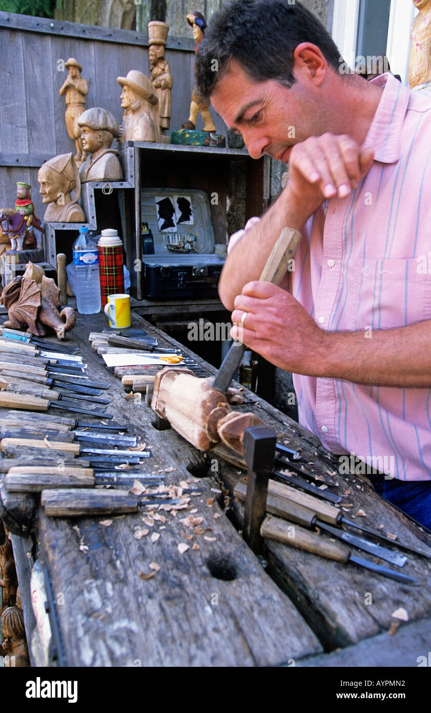 Wood carver at work at Locronon Stock Photo - Alamy