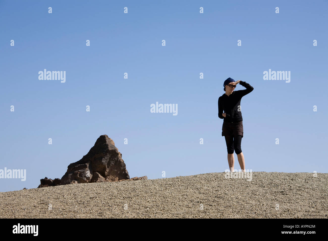 Woman keeping lookout Stock Photo - Alamy