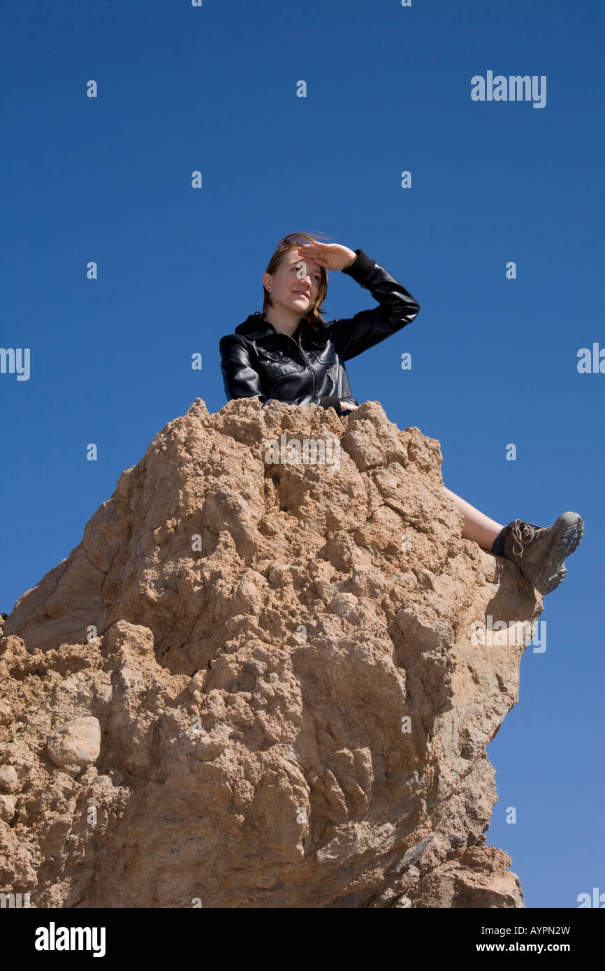 Woman keeping a lookout Stock Photo - Alamy