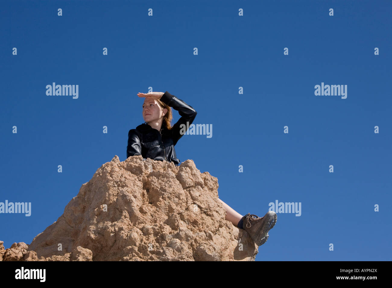Woman keeping a lookout Stock Photo - Alamy