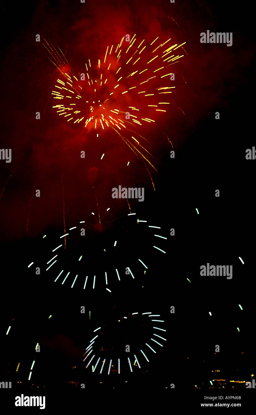 Fire crackers bursting in the sky at night Stock Photo - Alamy
