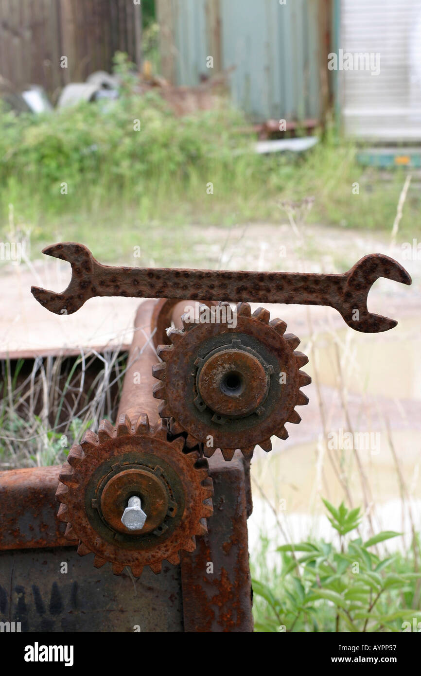 Front view of junk gears and a tool above it Stock Photo - Alamy