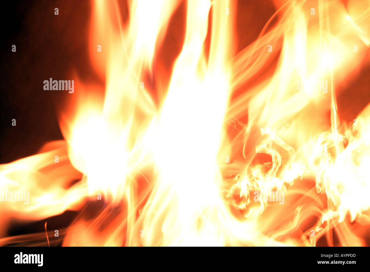 Picture of a bright fire glowing in the dark Stock Photo - Alamy