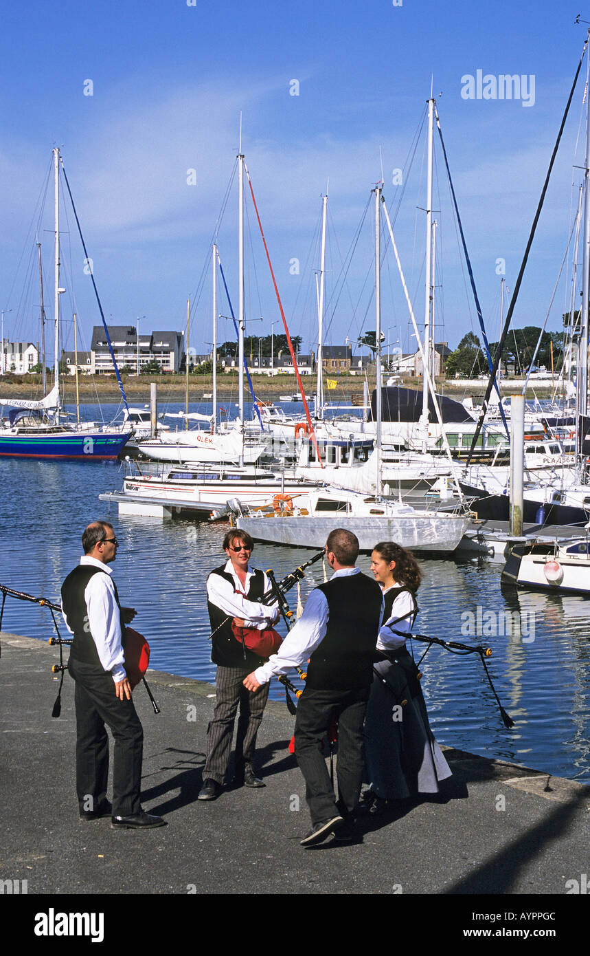 Traditional Breton musicians on quayside at Peros Guirec Stock Photo ...