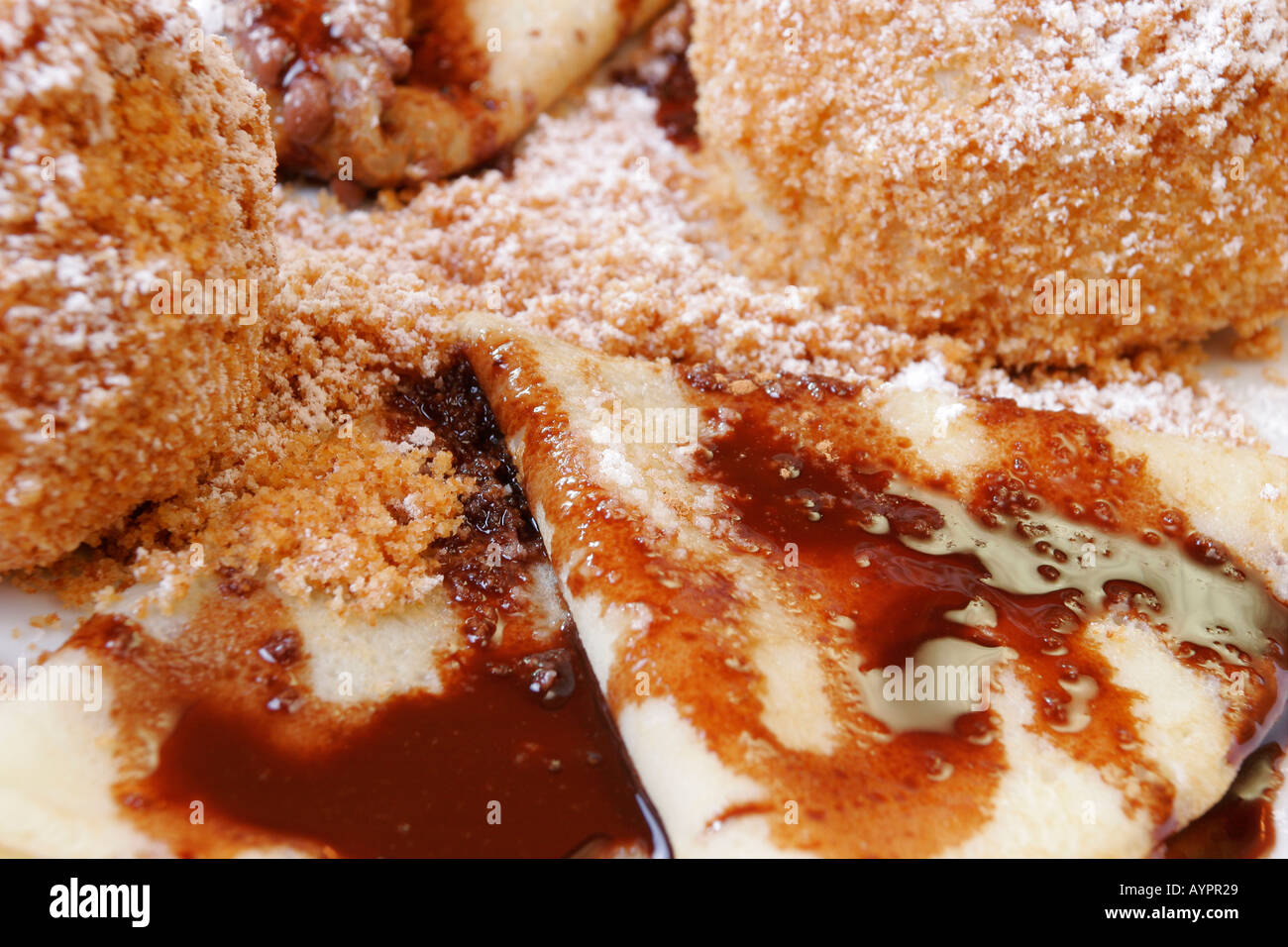 A tempting dish with chocolate topping and powdered sugar Stock Photo ...