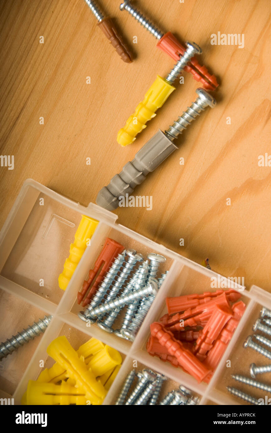 close up of screws and wallplugs in plastic box Stock Photo - Alamy