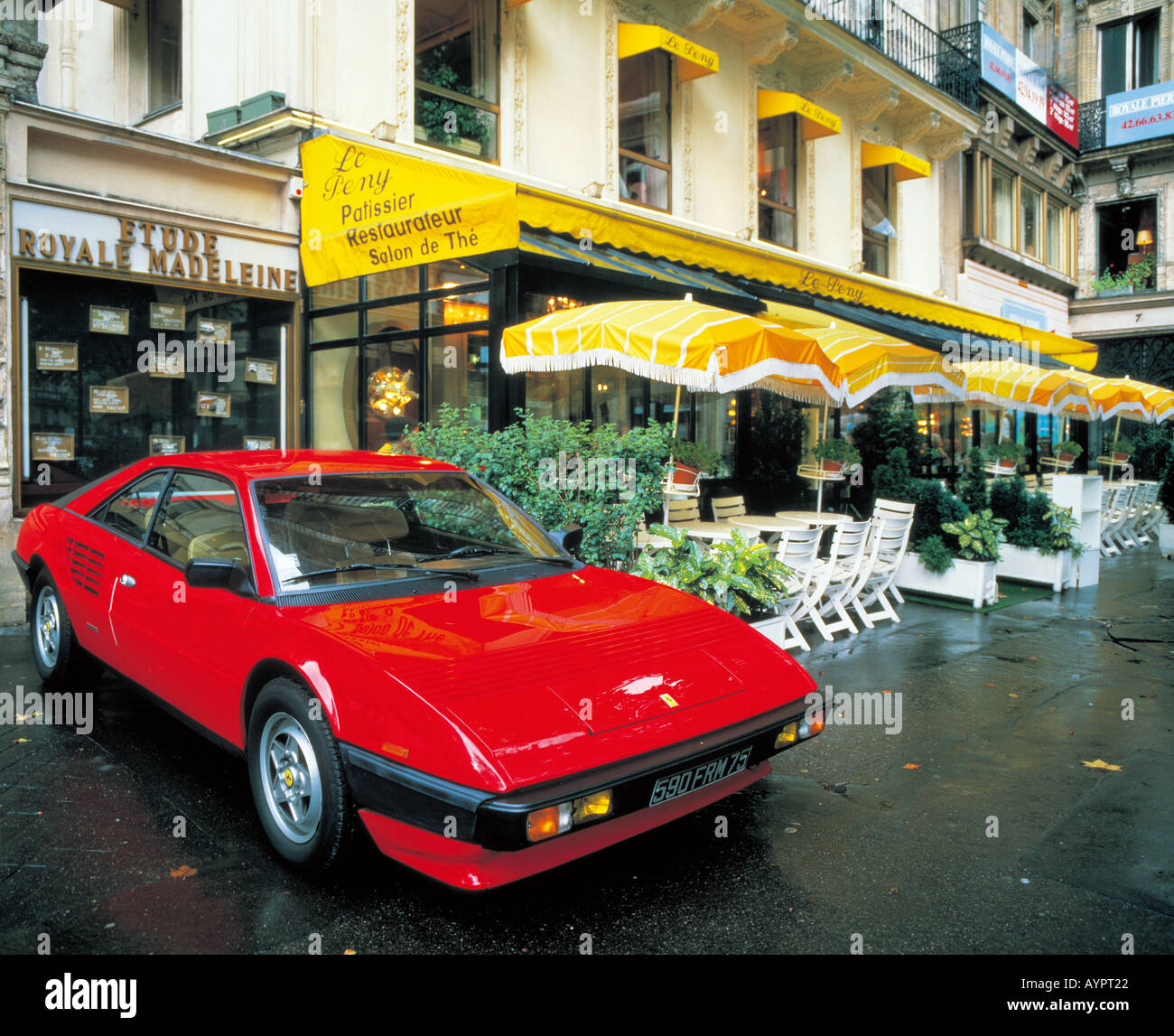 Yellow Canopy Café with Red Car Stock Photo - Alamy