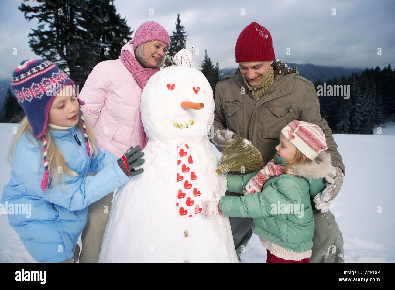 Girls making snowman hi-res stock photography and images - Alamy