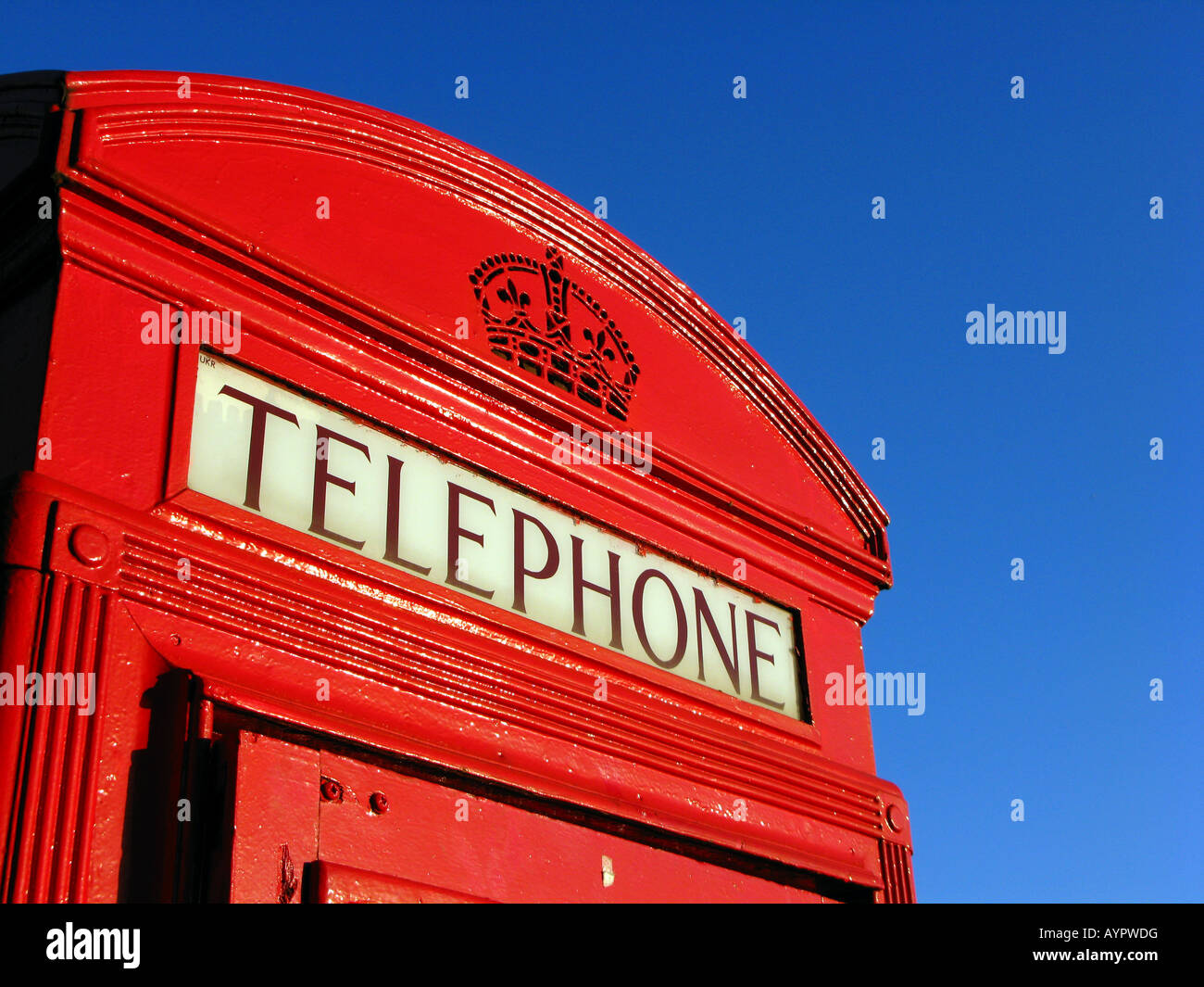 Traditional red British telephone box against a blue sky Stock Photo ...