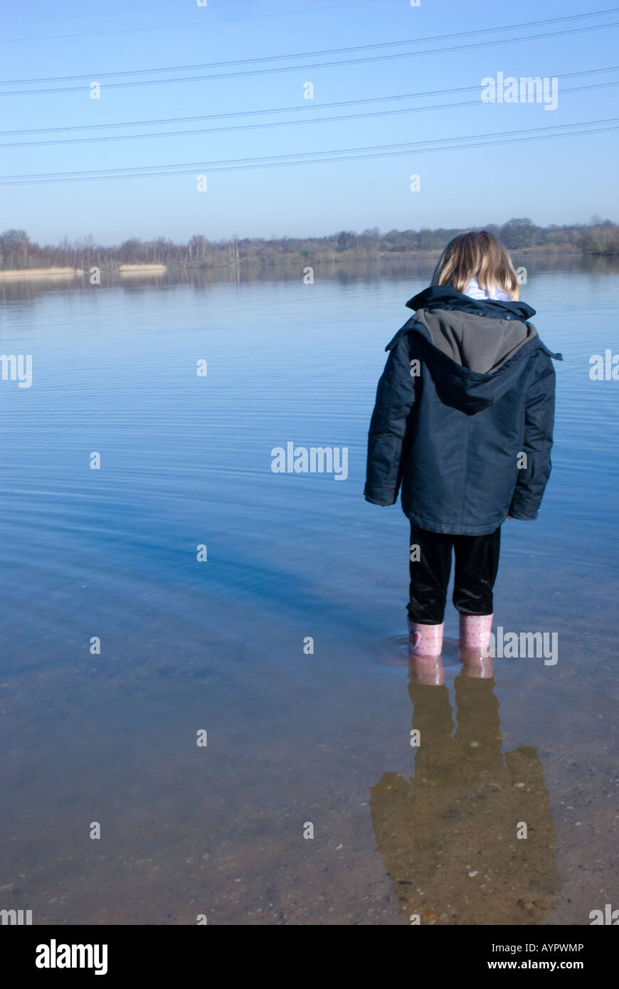 Girl standing in lake, water Stock Photo - Alamy
