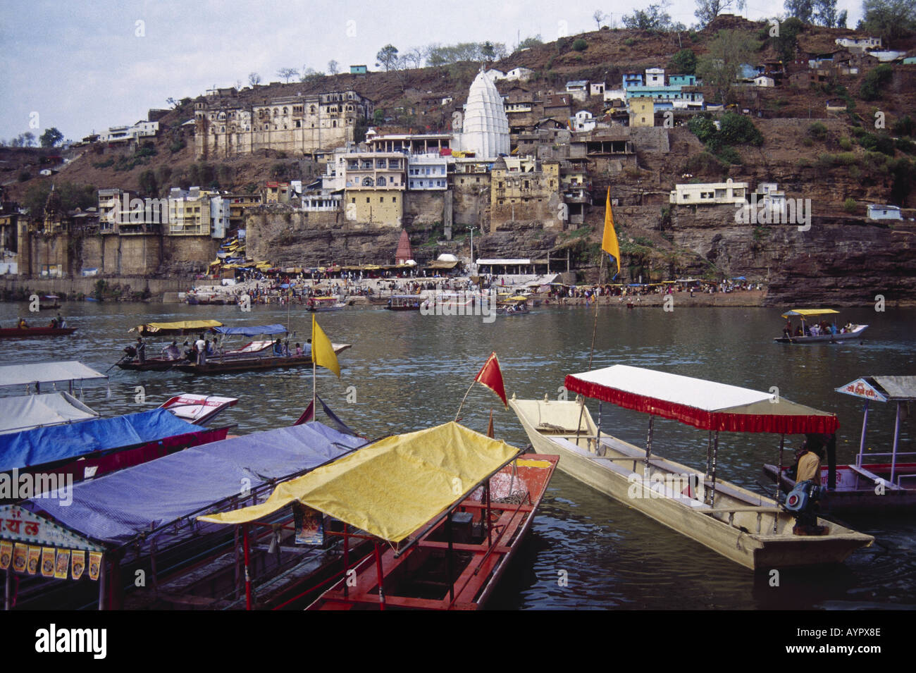 Narmada river and temple and boats Omkareshwar Madhya Pradesh India ...