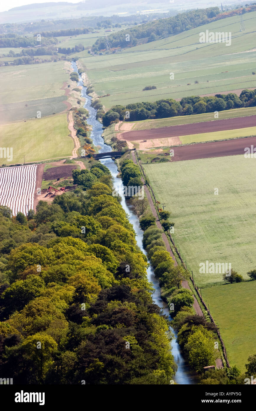 Aerial view of straight river running through cultivated fields - Fife ...