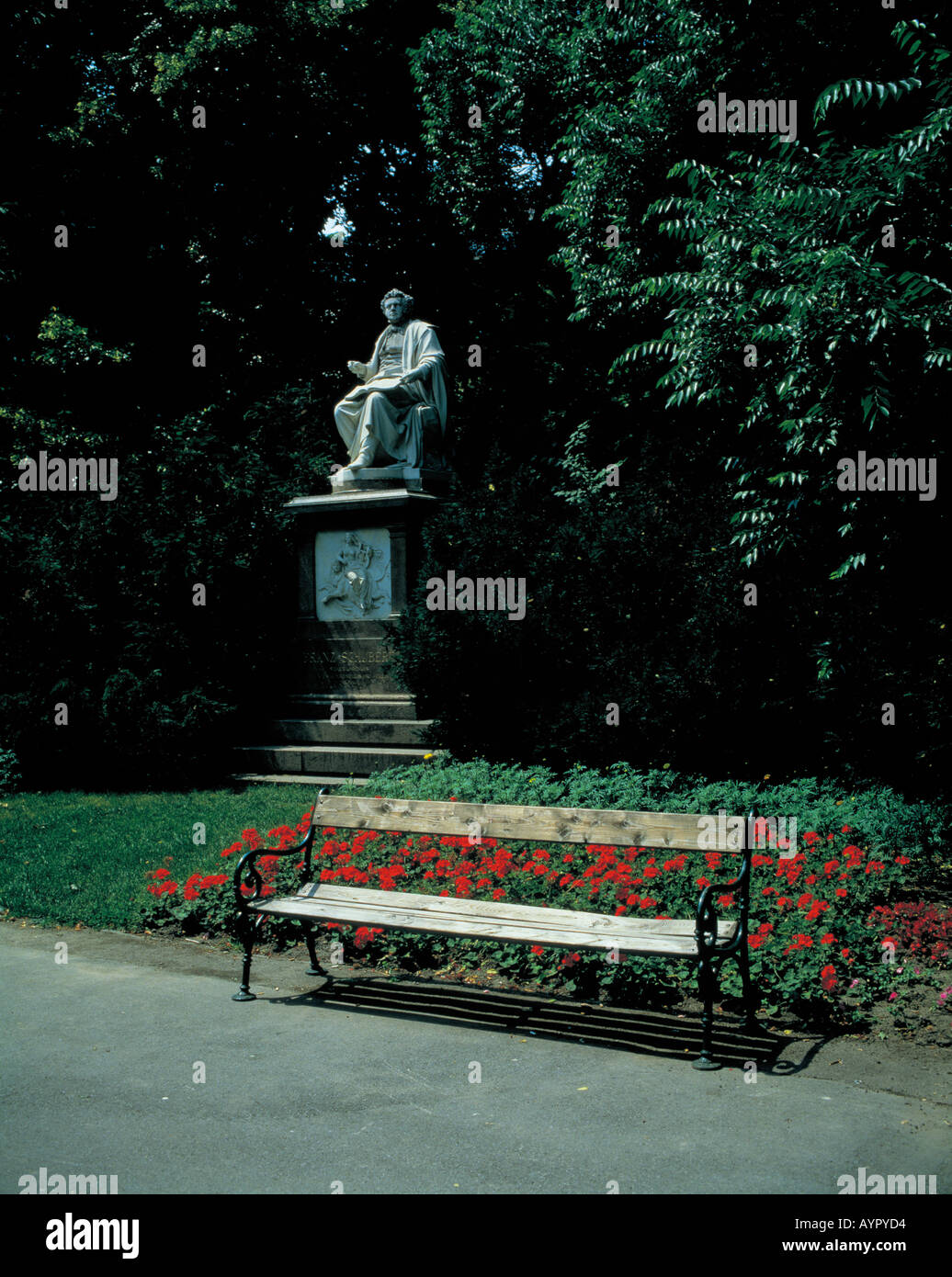 Statue with Bench Stock Photo - Alamy