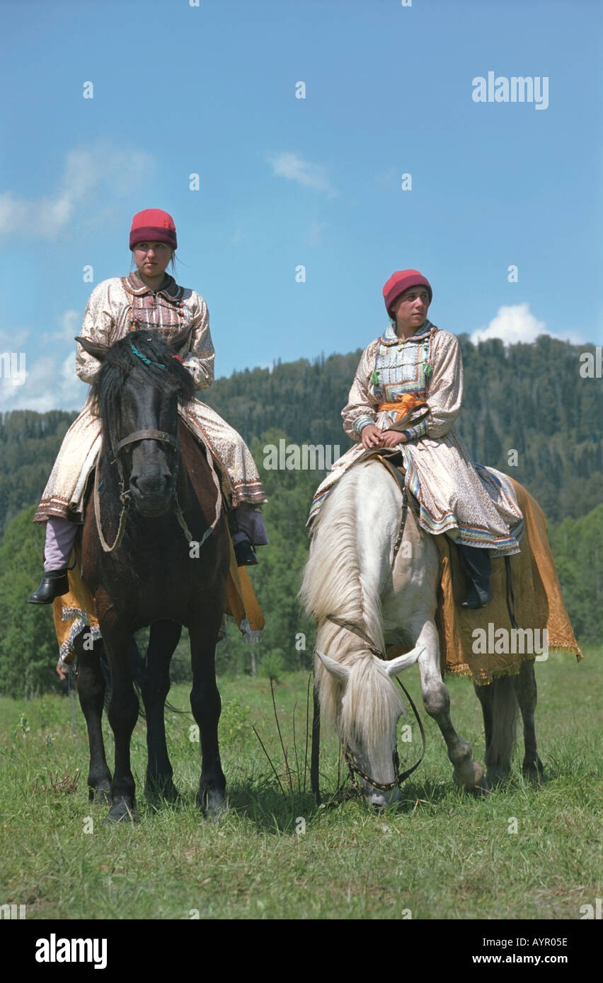 Horse riders in national Altaic costumes The ethnic festival El Oiyn ...