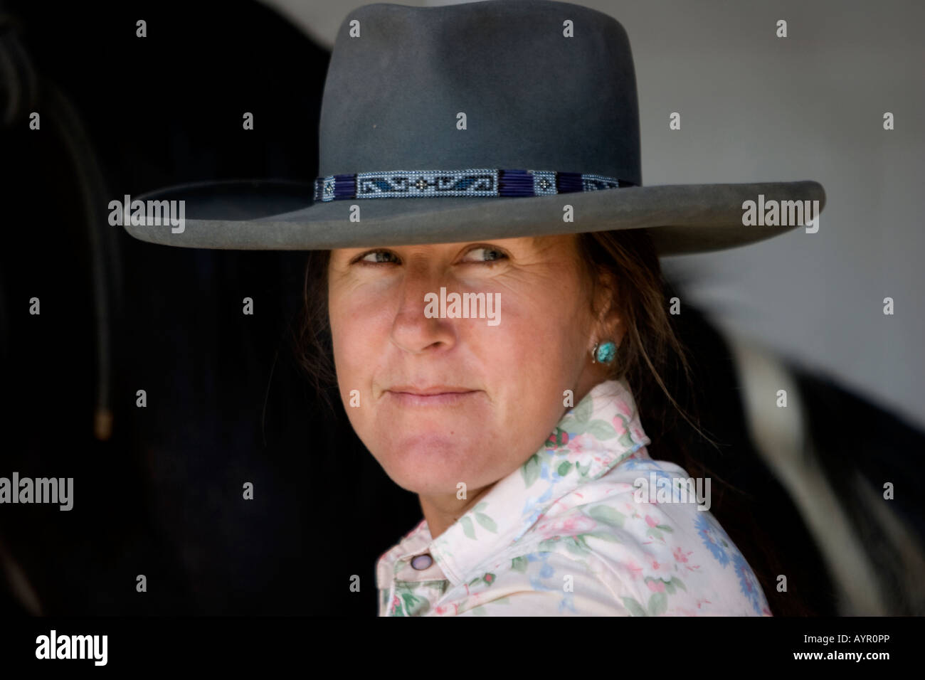 A cowgirl relaxes with her horse on a ranch in colorado Stock Photo - Alamy