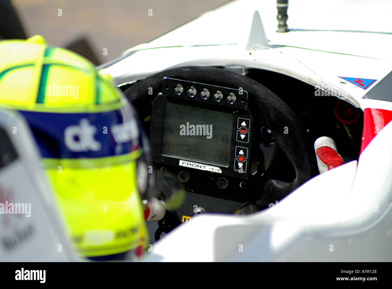 Motor racing driver sitting in car cockpit Stock Photo - Alamy