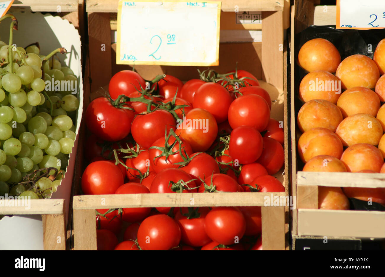 tomatoes for sale on display Stock Photo - Alamy