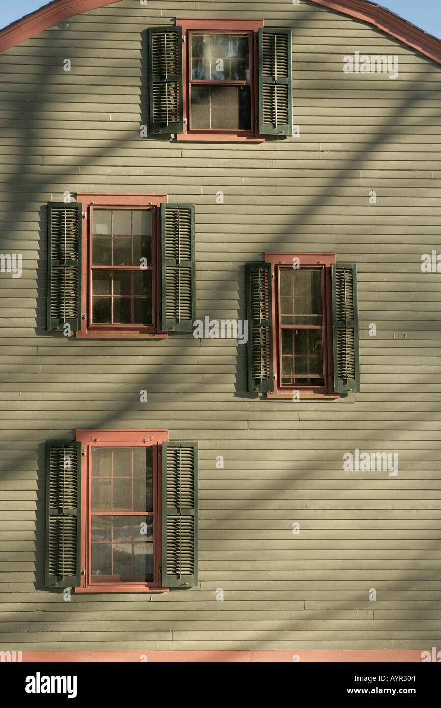 An exterior wall windows and shutters of an old house built in the 1850 ...