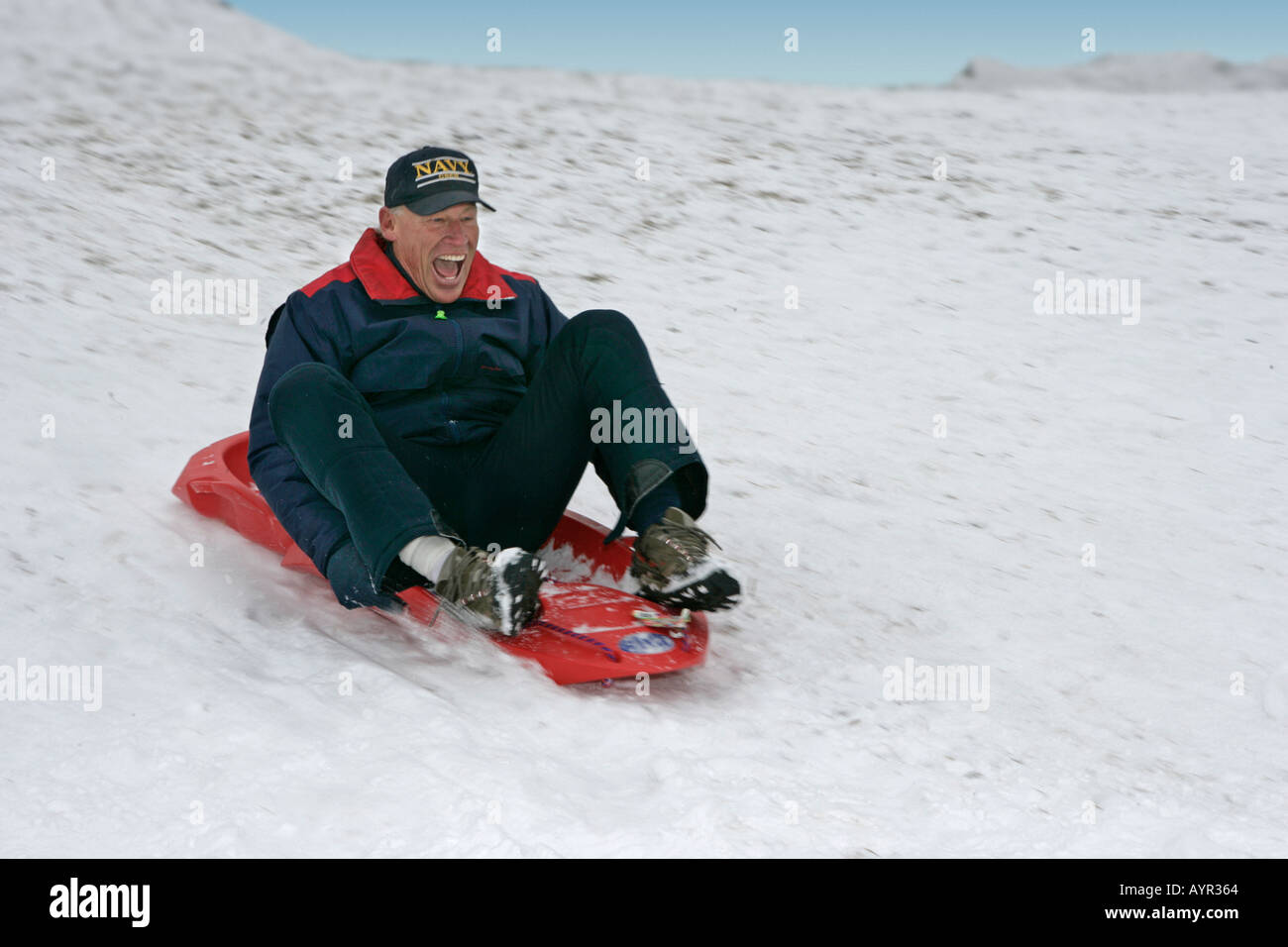 Man riding sled down hi-res stock photography and images - Alamy