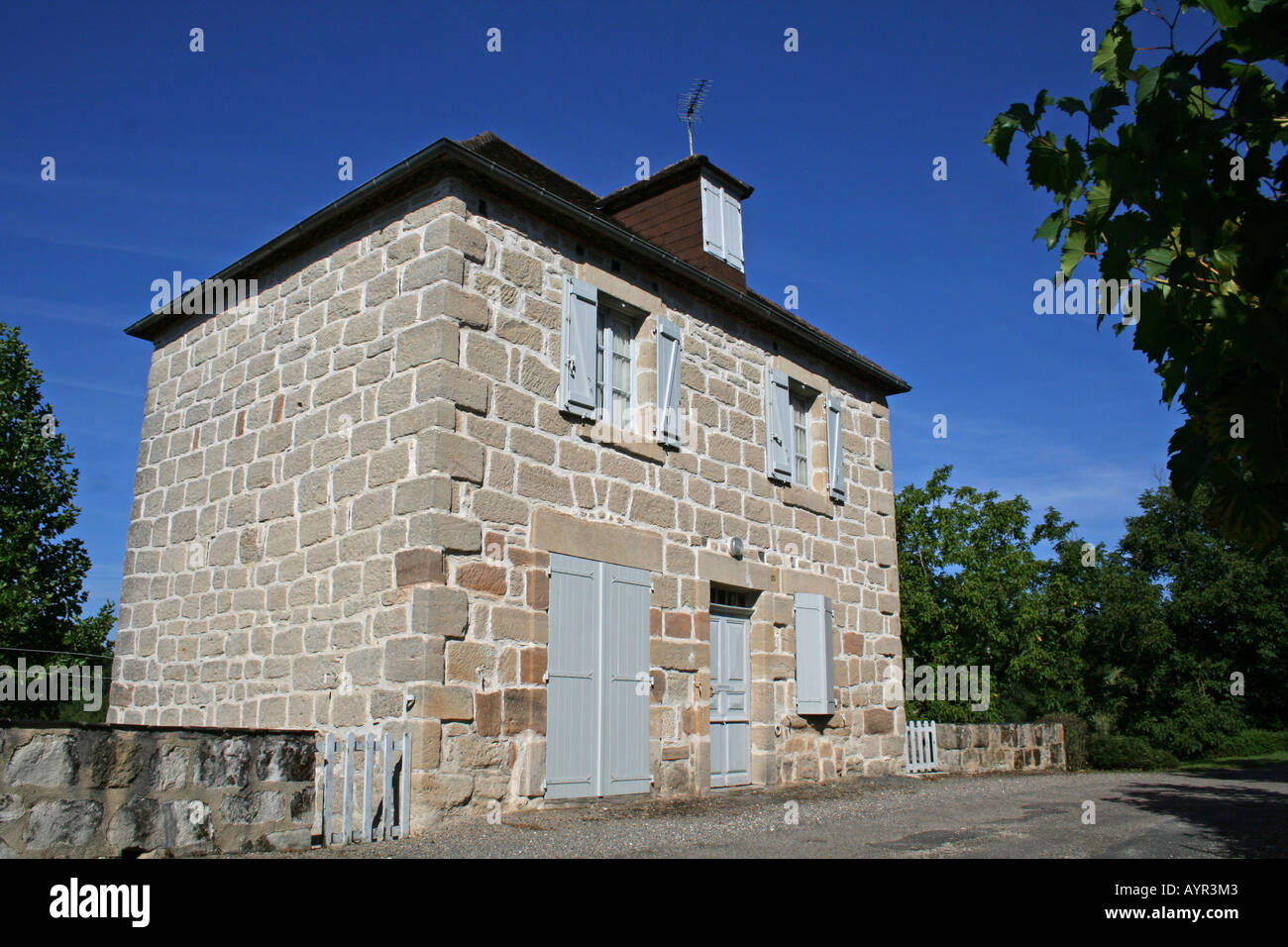 big stone house on street Stock Photo - Alamy