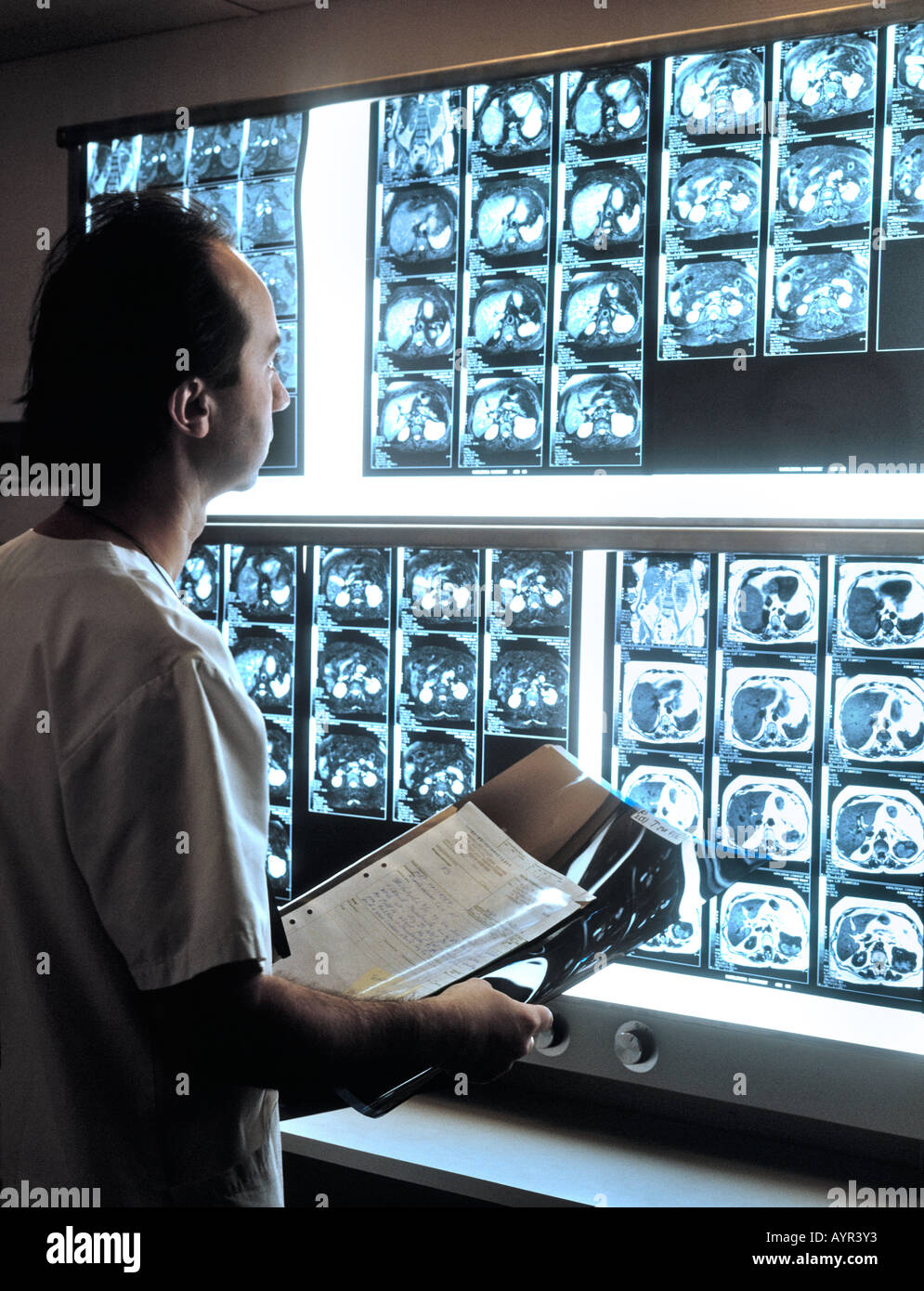 DOCTOR CHECKING X RAYS Stock Photo - Alamy