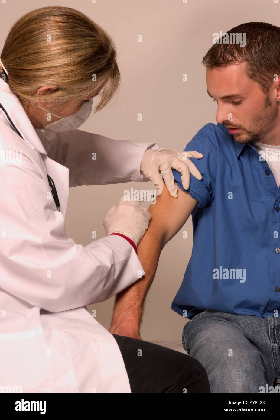 Nurse wearing medical gloves gives hi-res stock photography and images ...