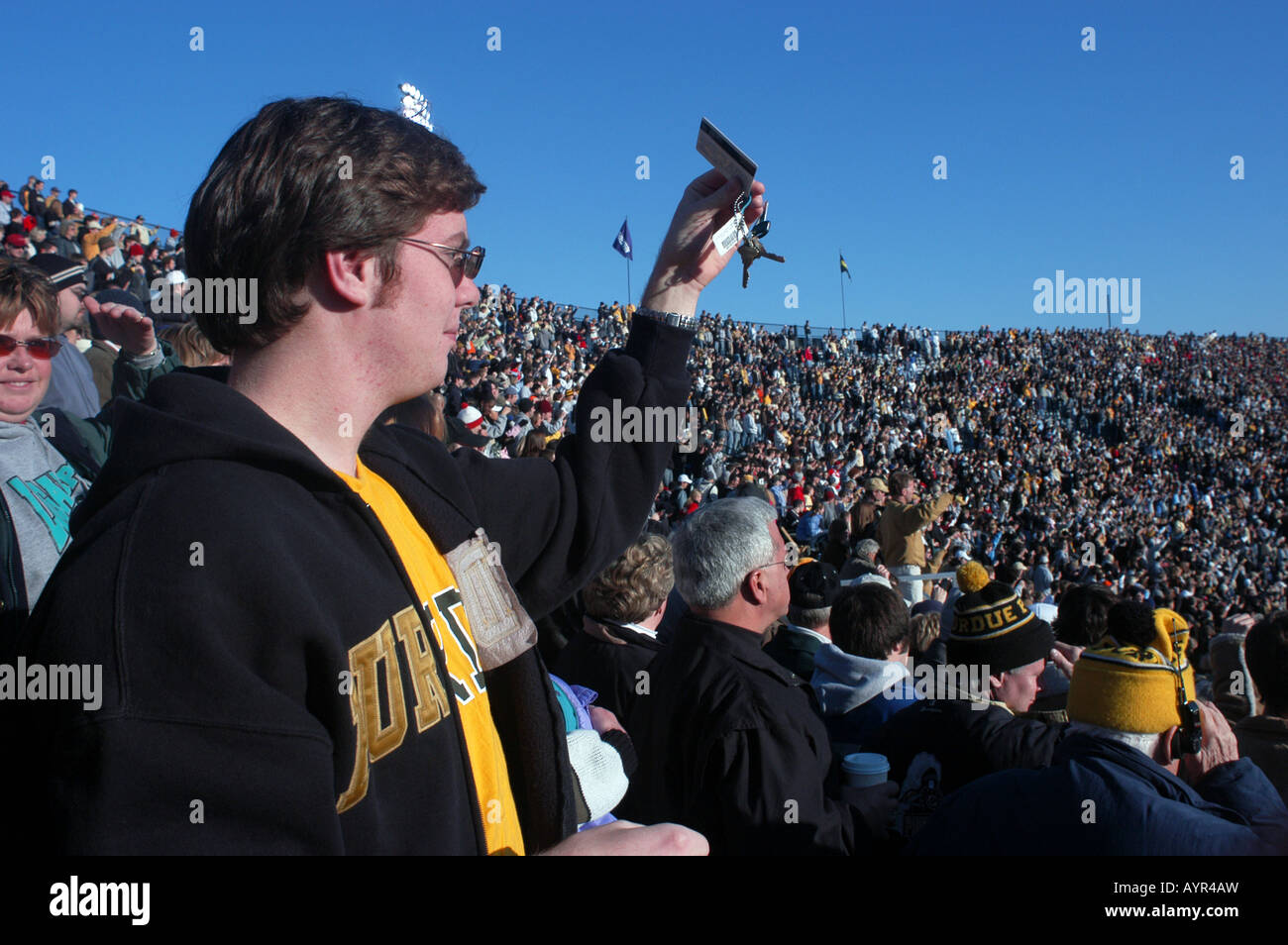College student cheers at Purdue University football game crowd jingles ...