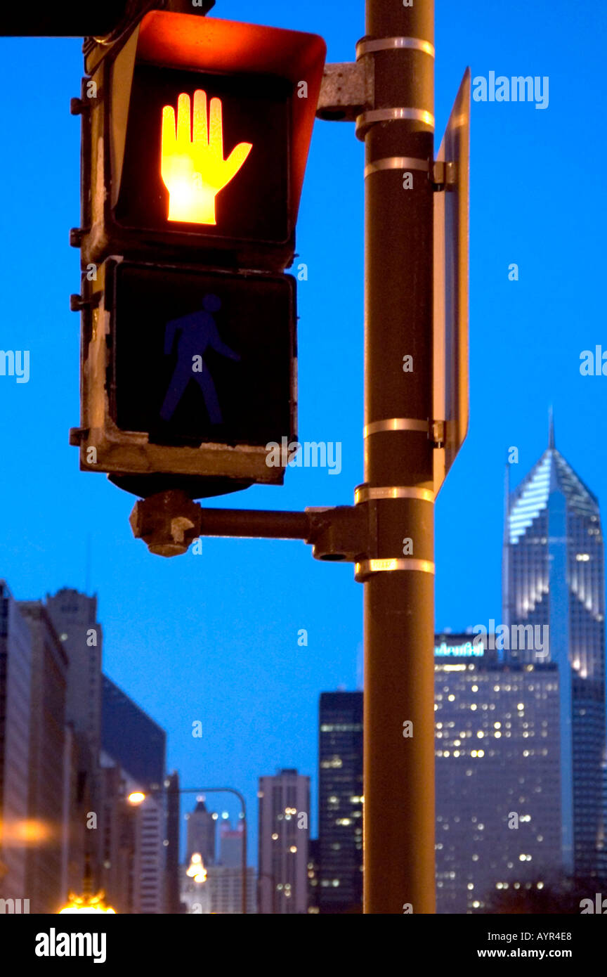 PEDESTRIAN STOP WALKING TRAFFIC SIGN WITH SKYSCRAPERS IN THE BACKGROUND ...