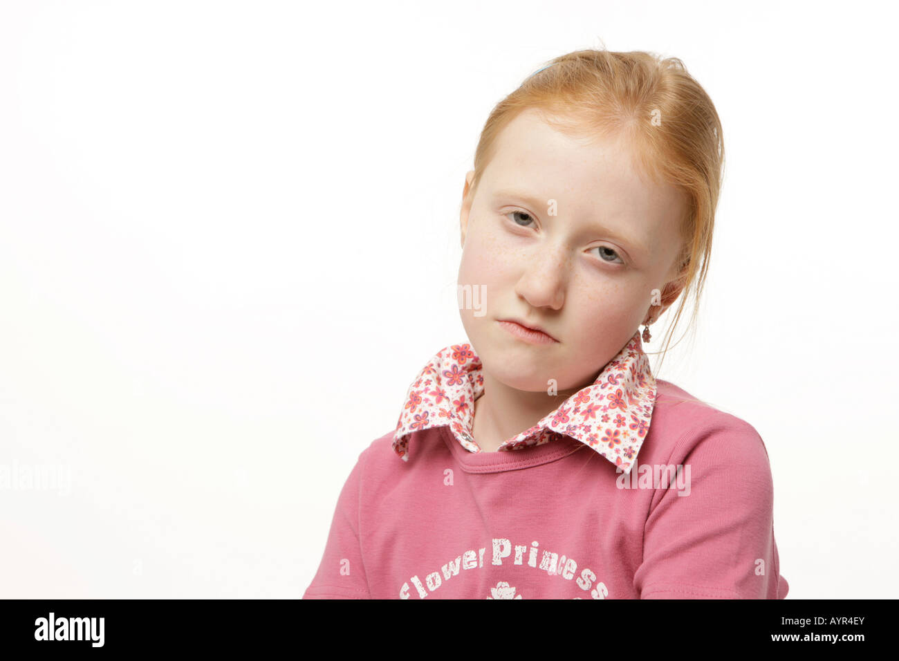 Eight-year-old girl looking annoyed Stock Photo - Alamy