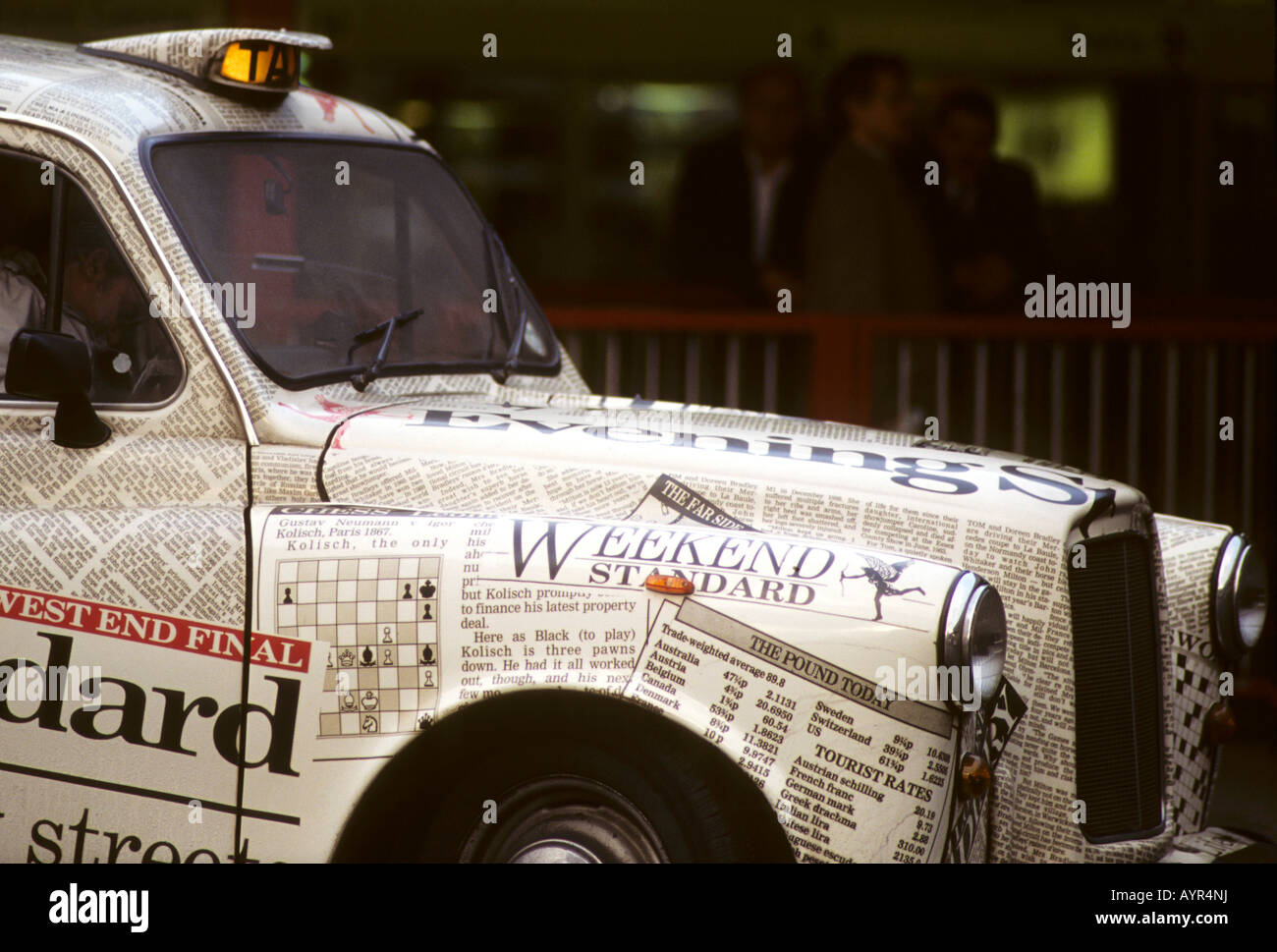Austin FX4 taxi painted with newspaper print, London, England, UK Stock ...