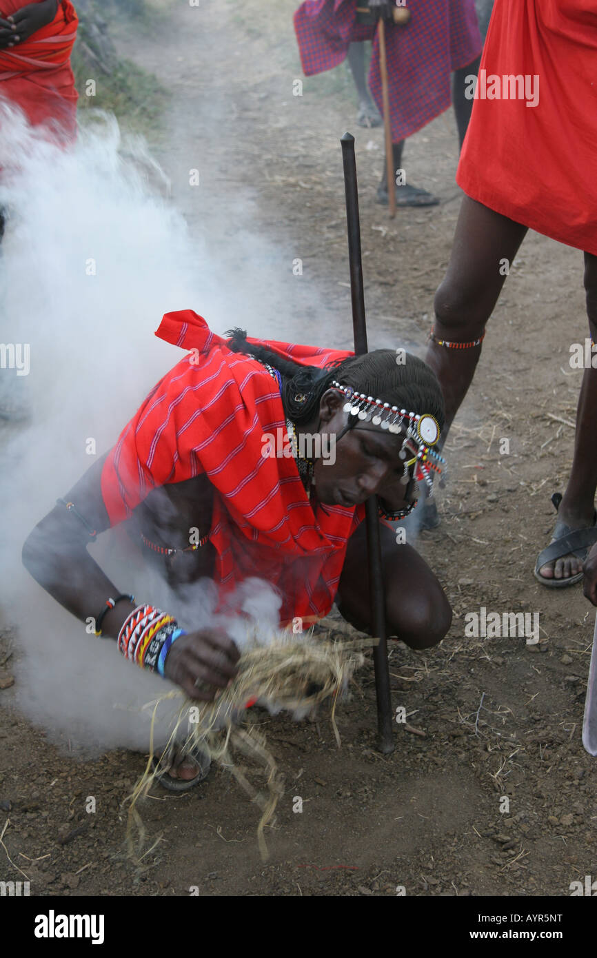 masai mara warrior lighting fire kenya africa Stock Photo - Alamy