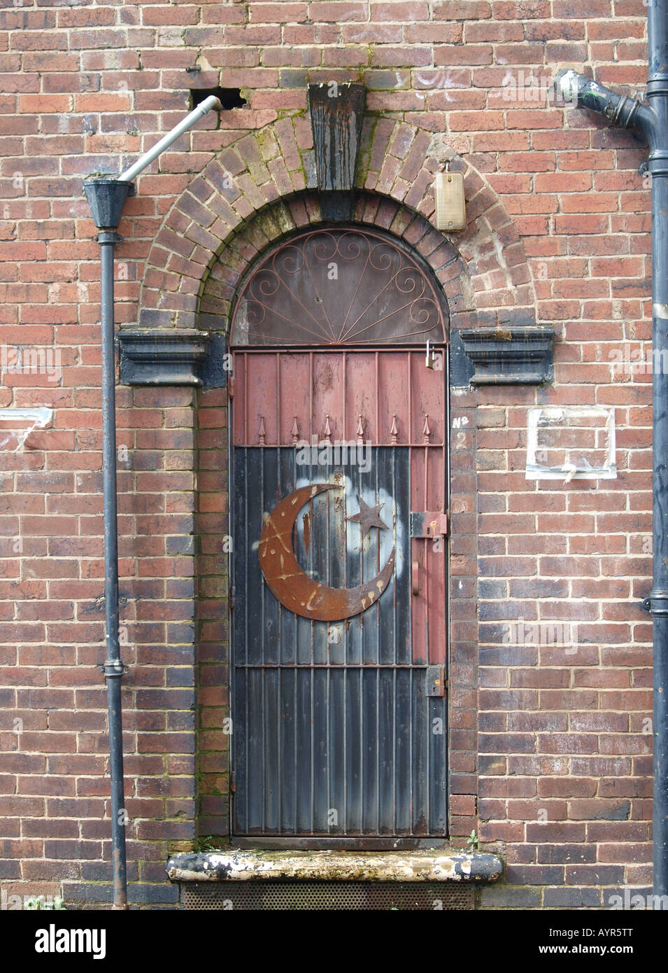Doorway with Muslim symbol and bars Stock Photo - Alamy