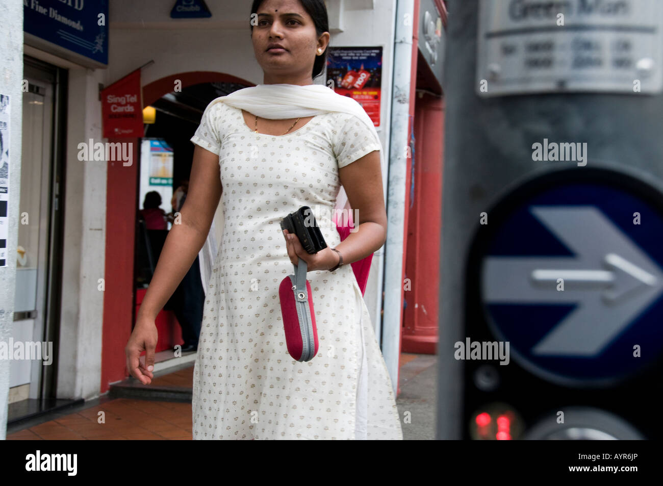 Indian woman walking on a sidewalk in Little India Singapore Stock ...