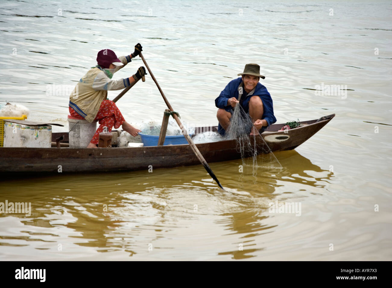 Couple fishing from rowboat on the Han River, Danang, Vietnam Stock ...