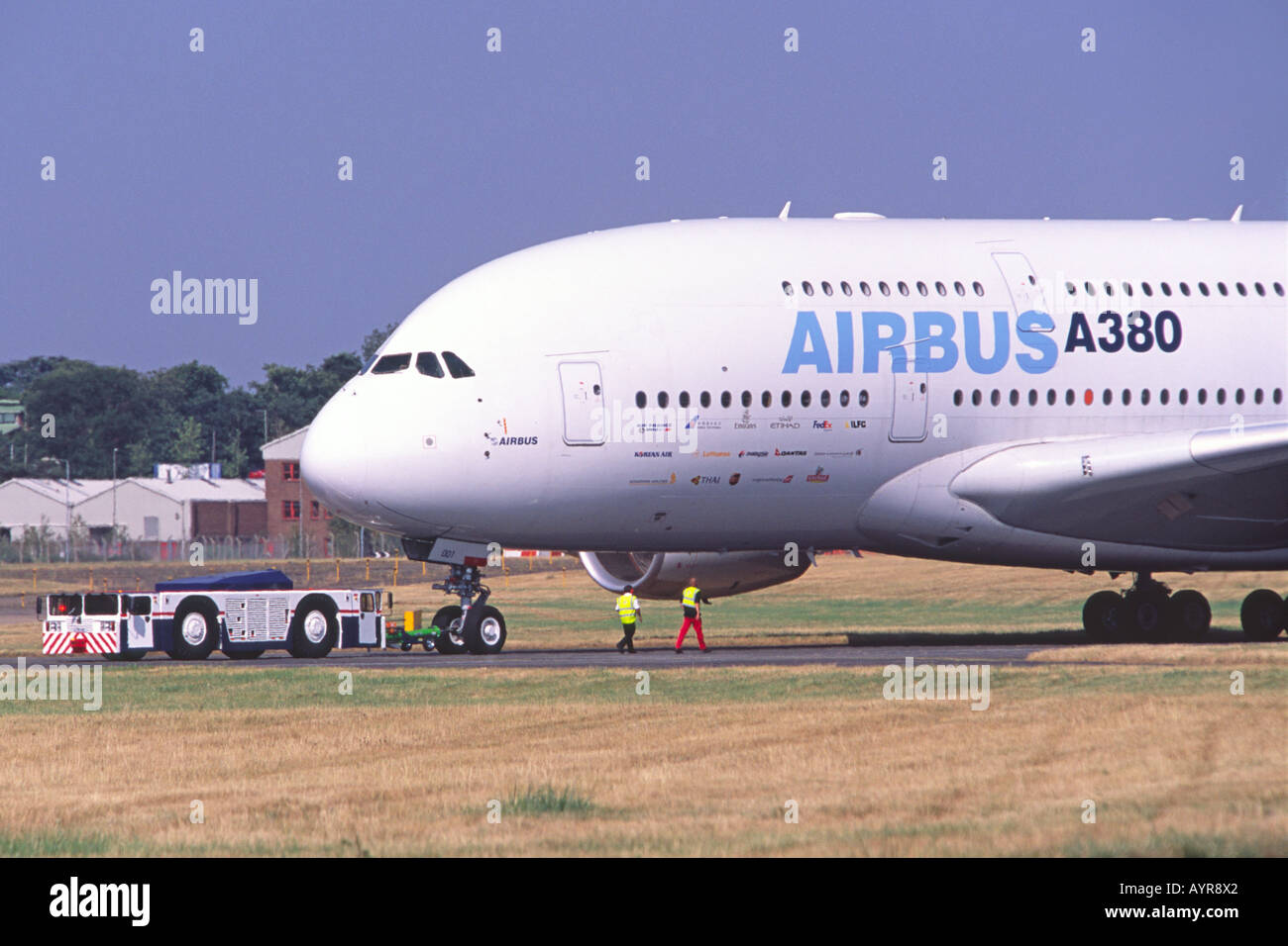 Airbus A380 being pushed back by Douglas DC12 aircraft tug at ...