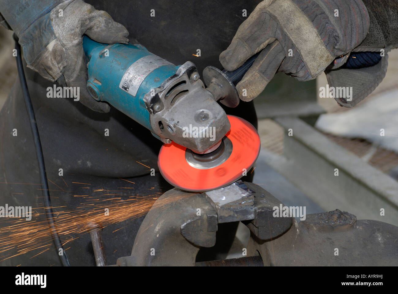 Man works grinder hi-res stock photography and images - Alamy