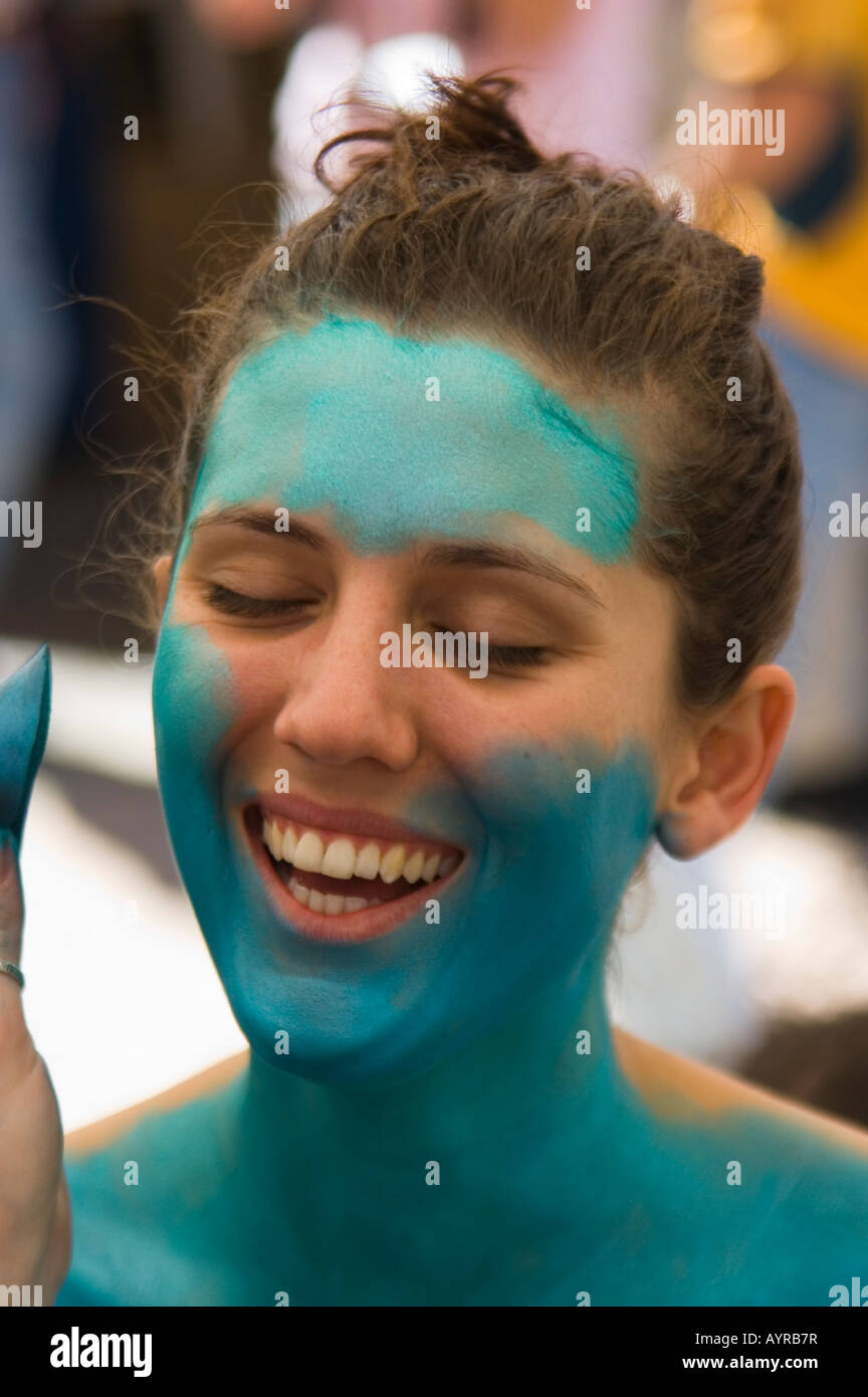 woman having face painted blue Stock Photo - Alamy