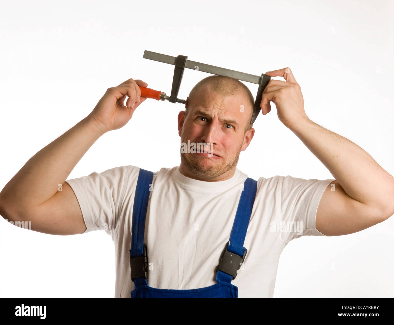 Construction worker holding bar clamp (c-clamp, screw clamp) over his ...