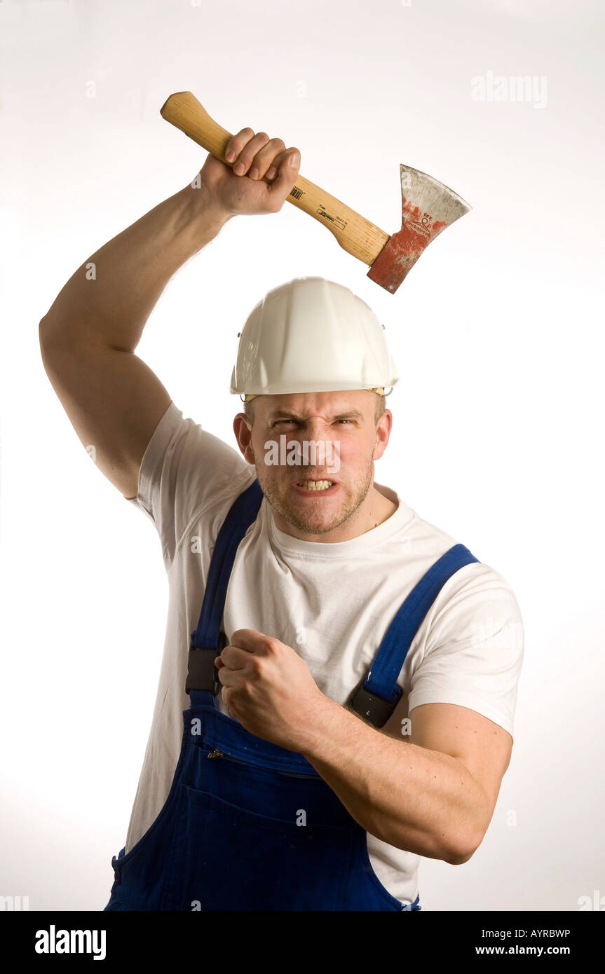 Construction worker wielding a hatchet Stock Photo - Alamy
