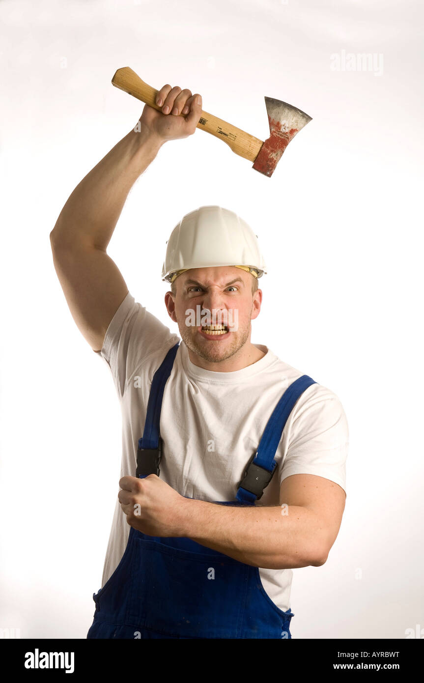 Construction worker wielding a hatchet Stock Photo - Alamy
