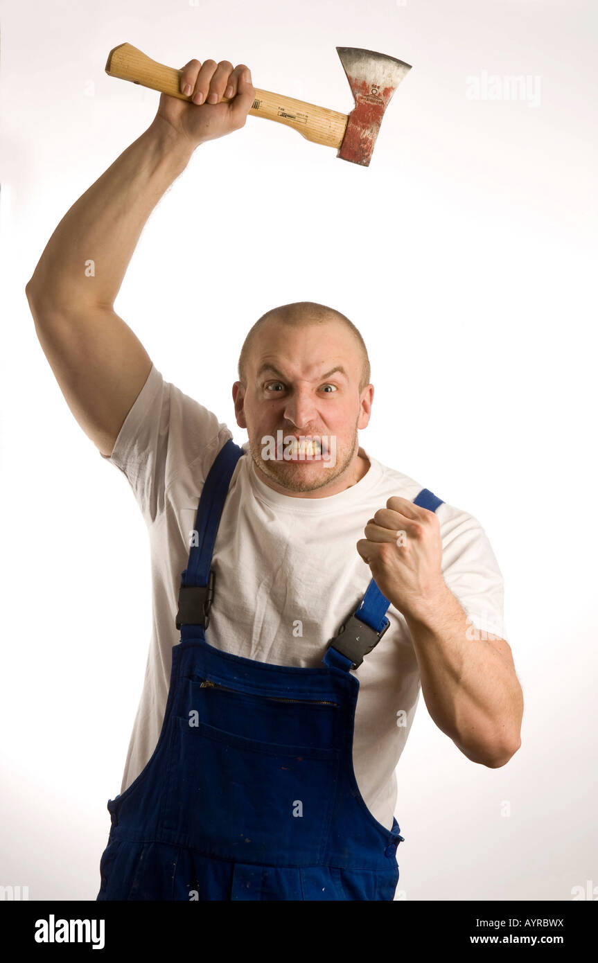 Construction worker wielding a hatchet Stock Photo - Alamy