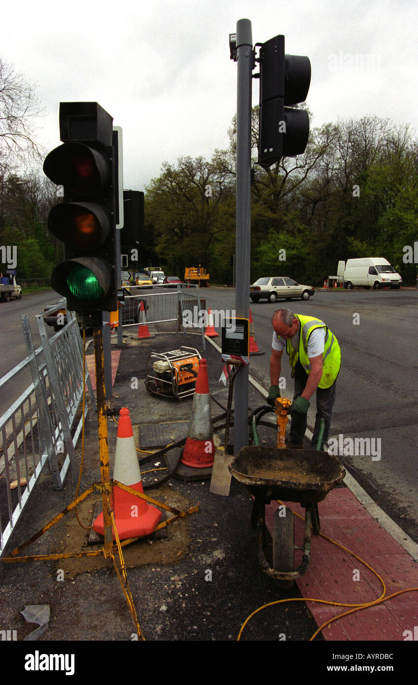 Workman undertaking roadside maintenance work Maidstone Kent Stock ...